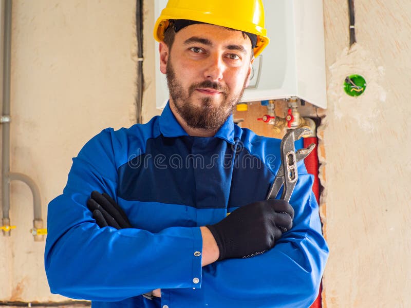 Portrait of Worker or Engineer in Blue Work Clothes and Yellow Safety ...