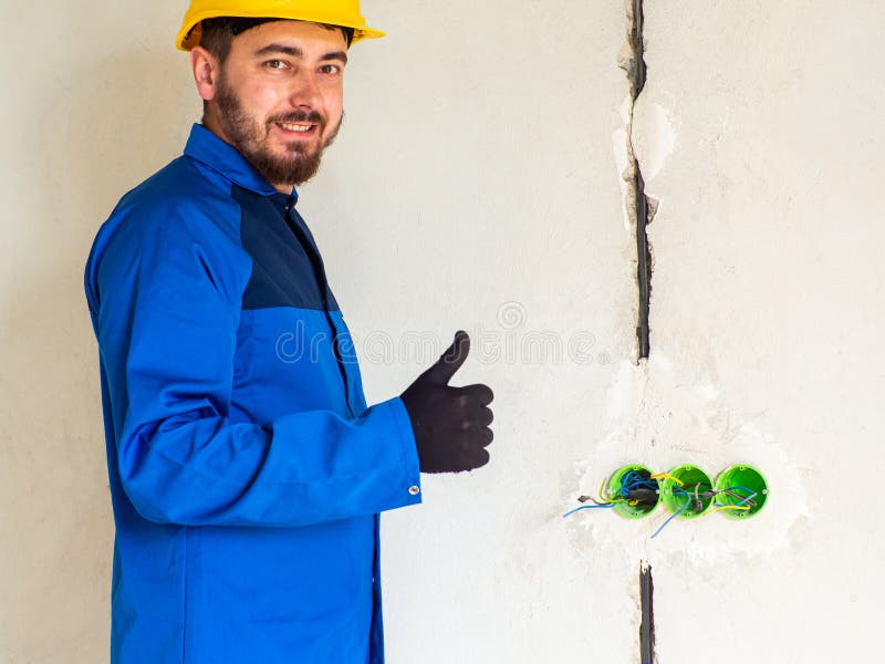 Portrait of Worker or Engineer in Blue Work Clothes and Yellow Safety ...