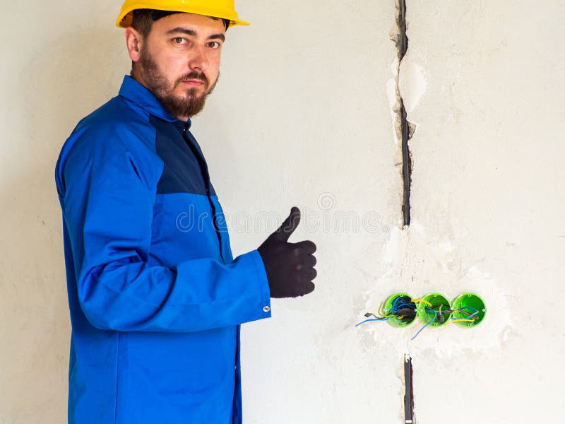 Portrait of Worker or Engineer in Blue Work Clothes and Yellow Safety ...