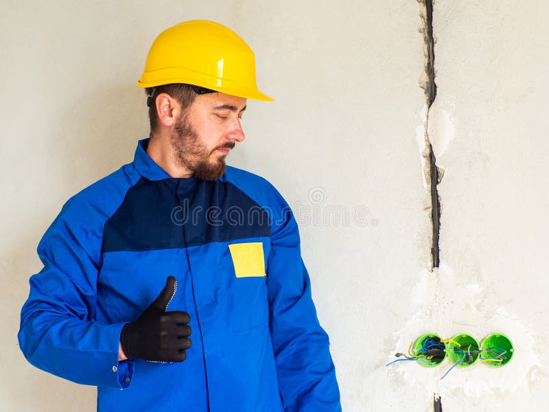 Portrait of Worker or Engineer in Blue Work Clothes and Yellow Safety ...
