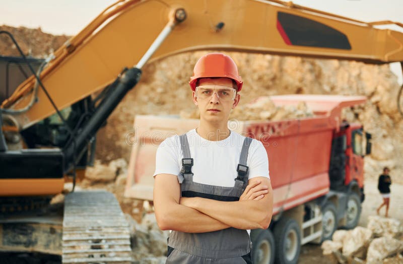 Portrait of Worker in Professional Uniform that is on the Borrow Pit at ...