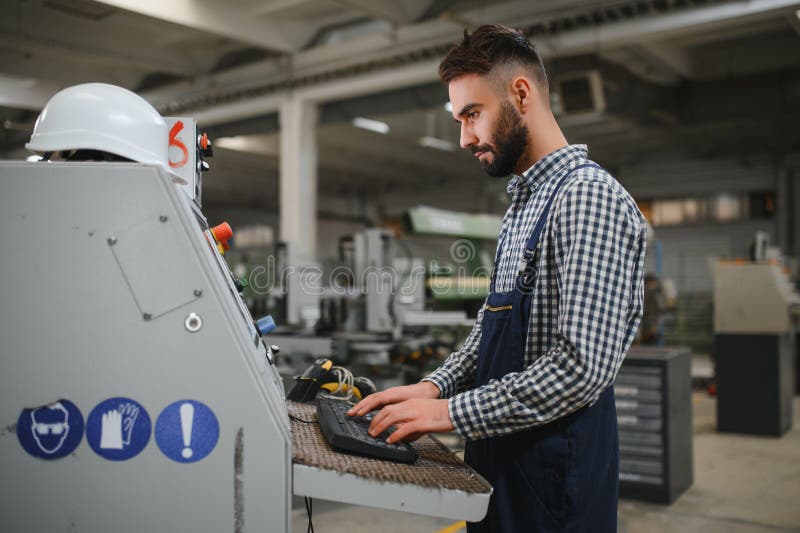 Portrait of a Worker in Uniform at the Factory Stock Photo - Image of ...