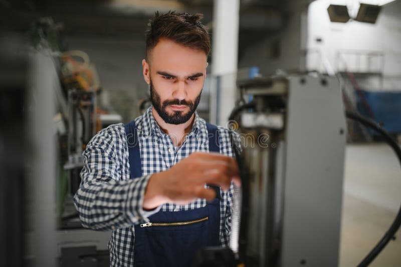 Portrait of a Worker in Uniform at the Factory Stock Photo - Image of ...