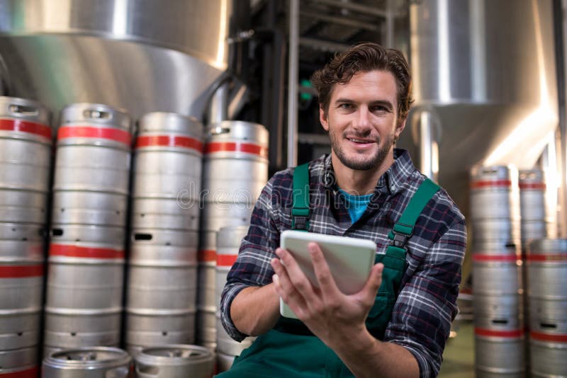 Portrait of Worker Using Tablet Computer in Warehouse Stock Image ...