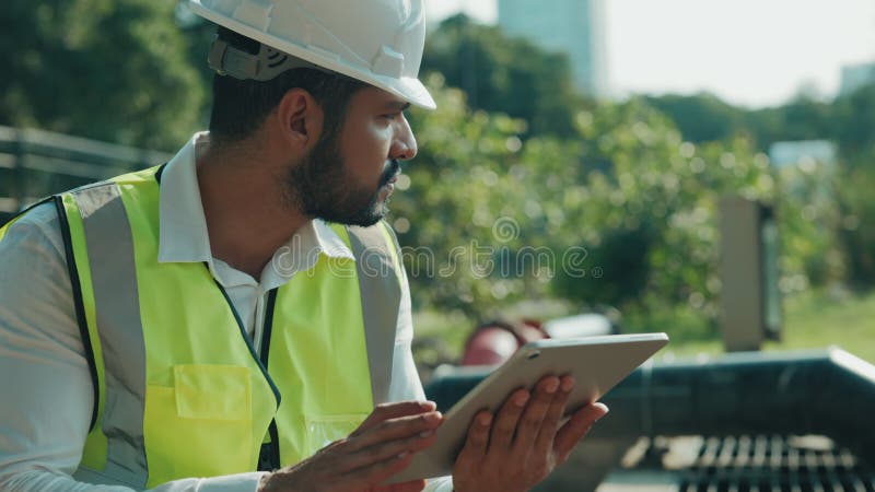 Portrait of Worker Using Tablet To Control Waste Water Treatment ...