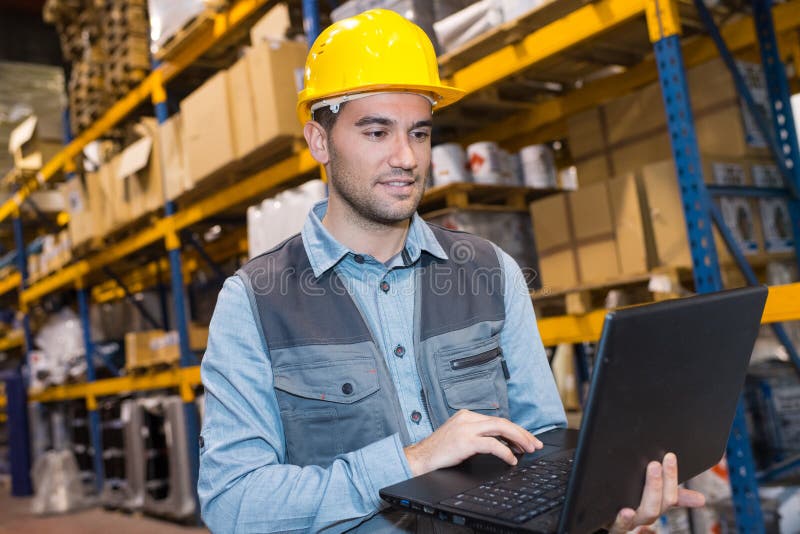 Portrait Worker in Warehouse with Laptop Computer Stock Image - Image ...