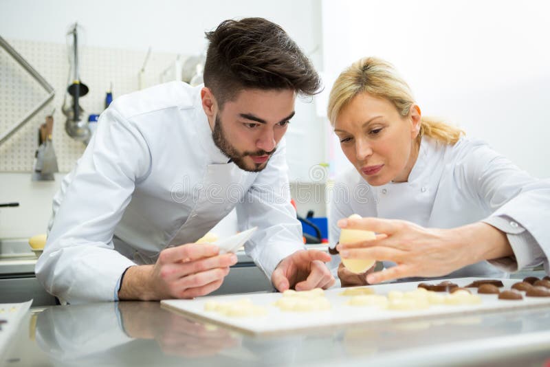 Portrait Workers Making Chocolate Eggs Stock Image - Image of kitchen ...