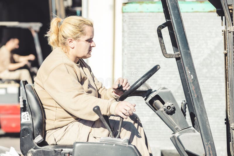 Portrait of a Working Woman Driving a Forklift Stock Image - Image of ...