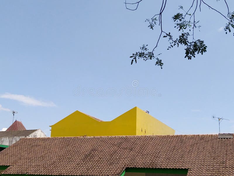 Portrait of a Yellow Building on a Clear Day Stock Photo - Image of ...