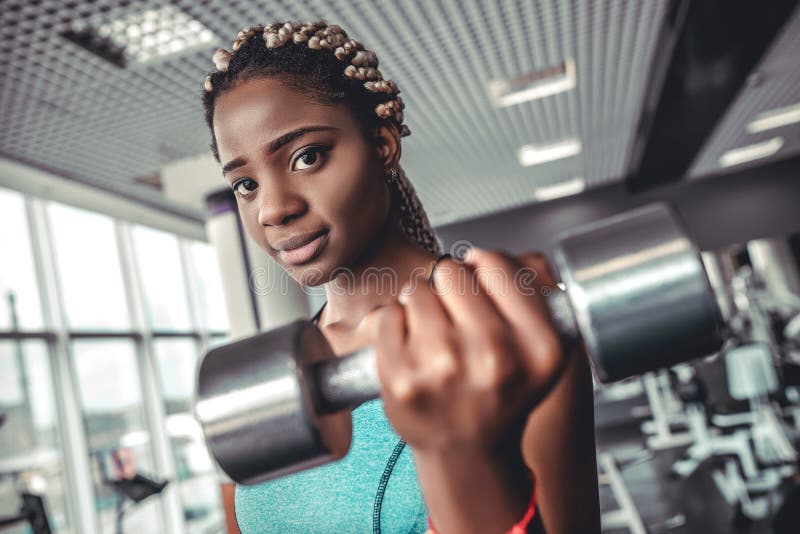 Happy Healthy Young African American Woman Working Out In A Gym With A