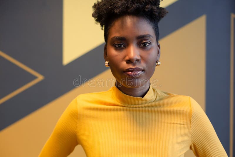 Portrait of Young African American Female Advisor Standing at Workplace ... Portrait of Young African American Female Advisor Standing at Workplace ...