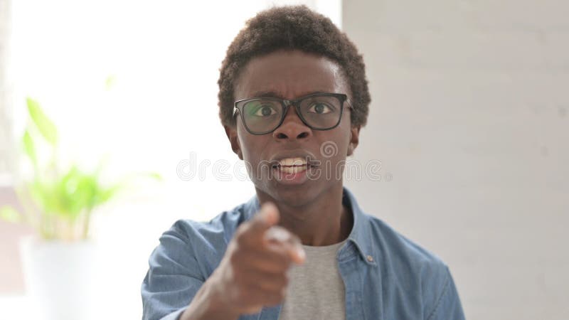 Portrait of Young African Man Feeling Angry, Fighting Stock Photo ...