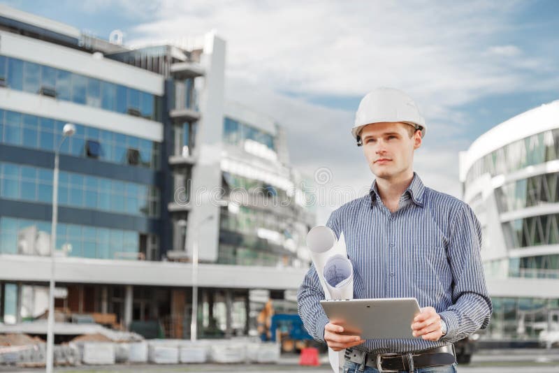 Portrait of Young Architect or Chief Engineer Uses Digital Tablet at ...