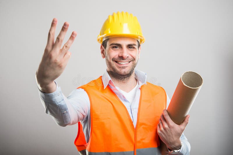 Portrait Of Young Architect Holding Blueprints Showing Number Th Stock ... Portrait Of Young Architect Holding Blueprints Showing Number Th Stock ...