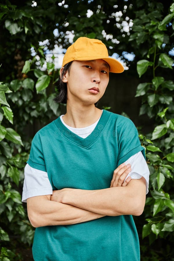 Asian Man Wearing Colorful Casual Wear Posing Outdoors Stock Image