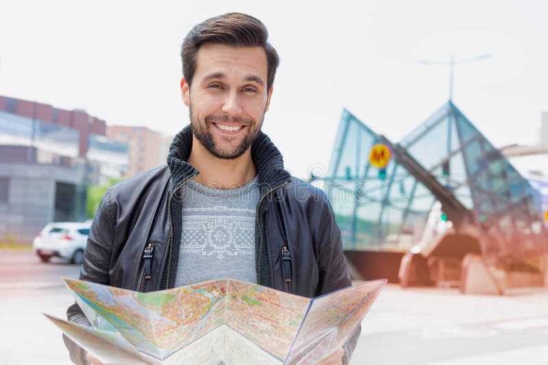 Portrait of Young Attractive Man Looking on the Map in the City Stock ...