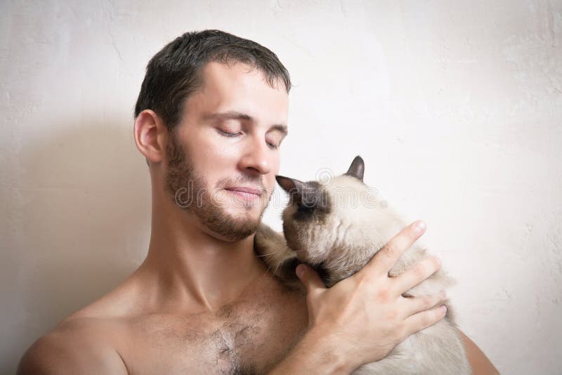 Portrait of a Young Attractive Smiling Man with Cat in Hands Stock ...