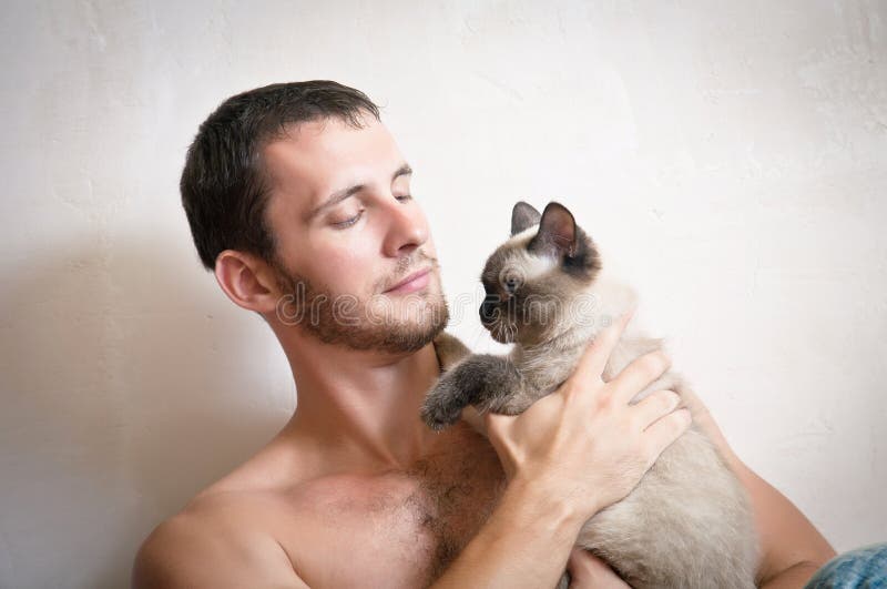 Portrait of a Young Attractive Smiling Man with Cat in Hands Stock ...