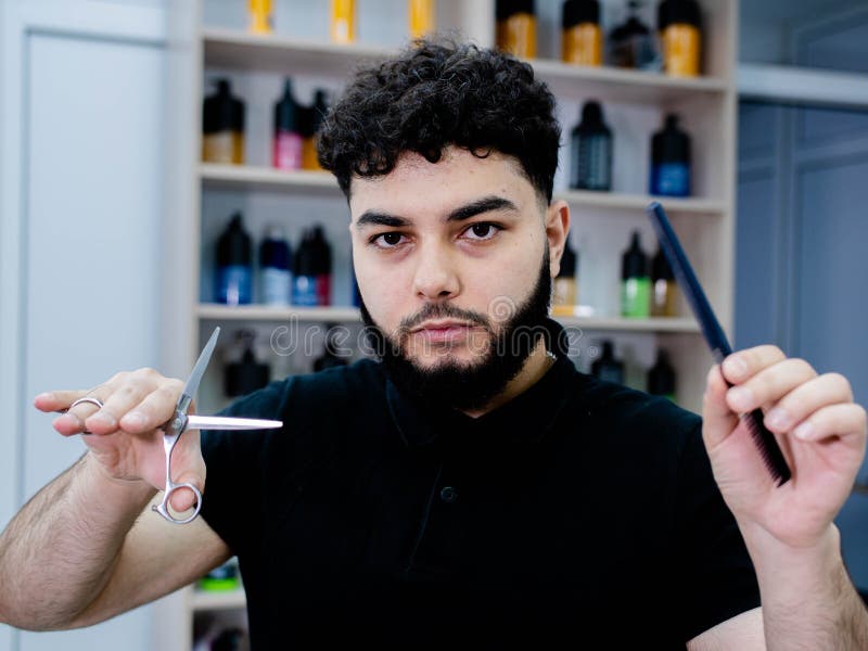 Portrait of a Young Barber with a Tool in His Hands. Scissors and ...