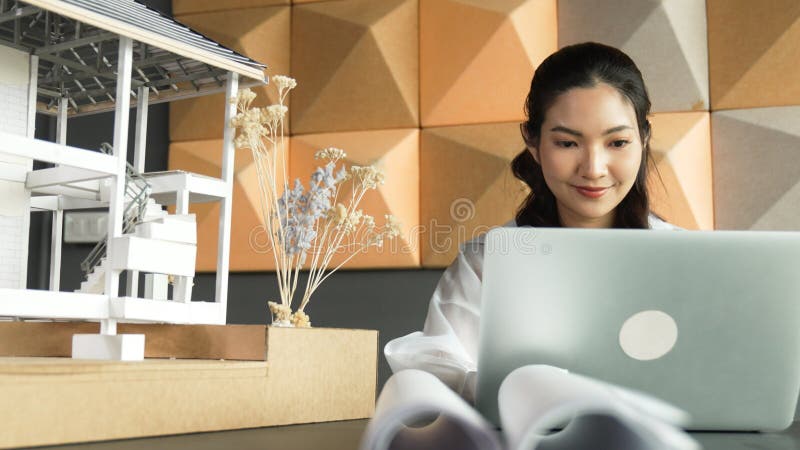 Young Beautiful Engineer Checking Roof Material and Using Laptop ...