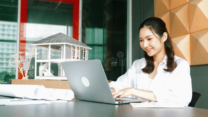 Young Beautiful Engineer Checking Roof Material and Using Laptop ...