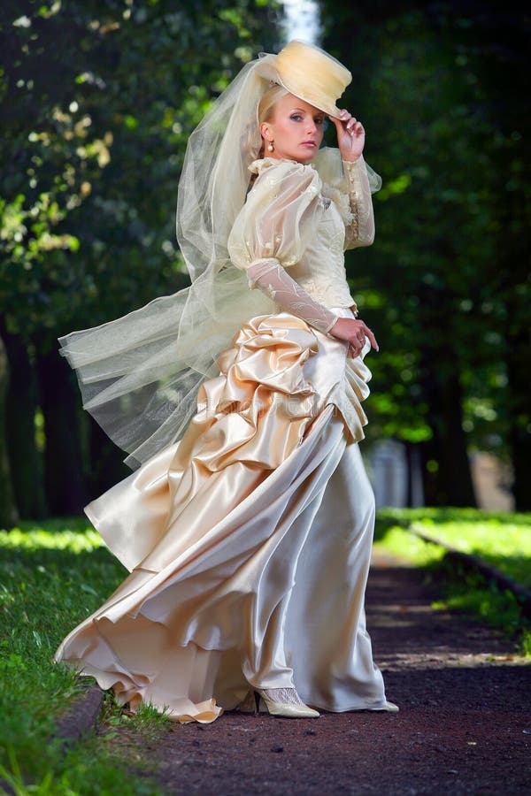 A Beautiful Bride Is Sitting On A Luxurious Sofa. Beautiful Model Girl ...