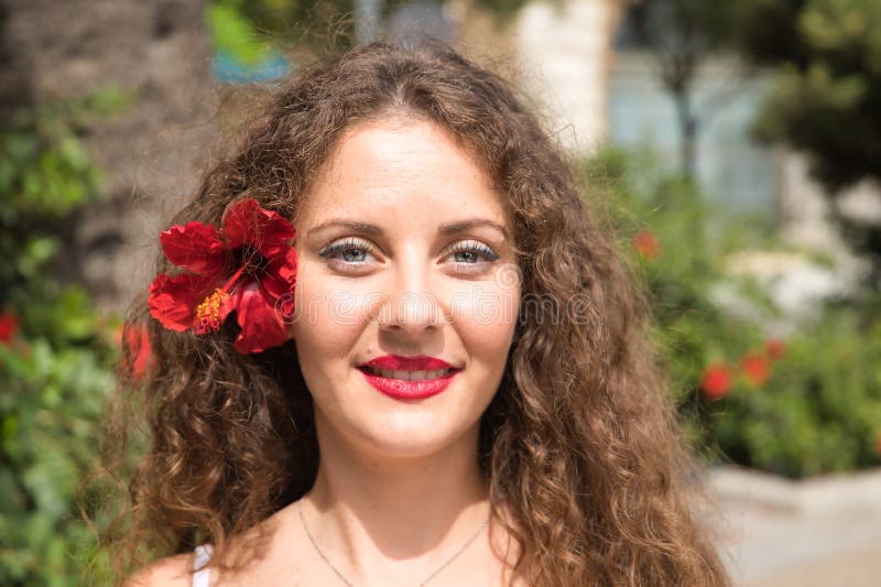 Portrait Of A Young And Beautiful Woman Blonde With Curly Hair And