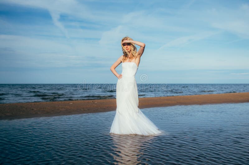 Portrait of Young Blond Bride Staying among the Water Stock Photo ...