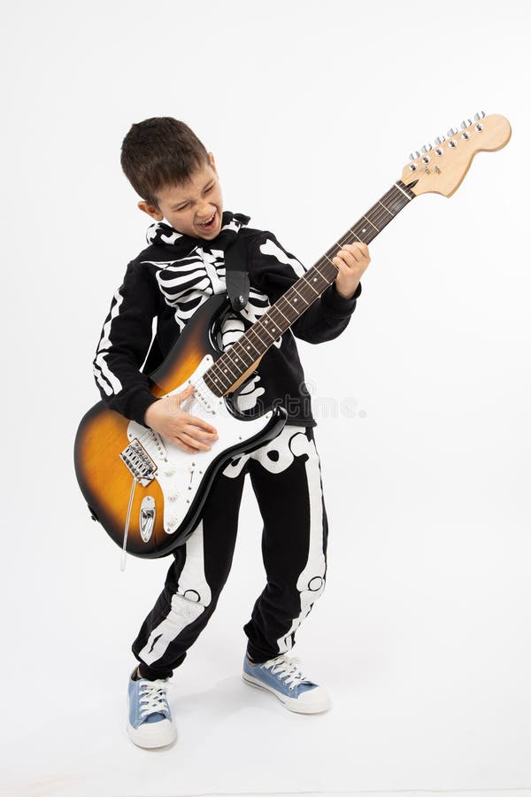Portrait of Young Boy Playing Electric Guitar. Boy Playing the Guitar ...