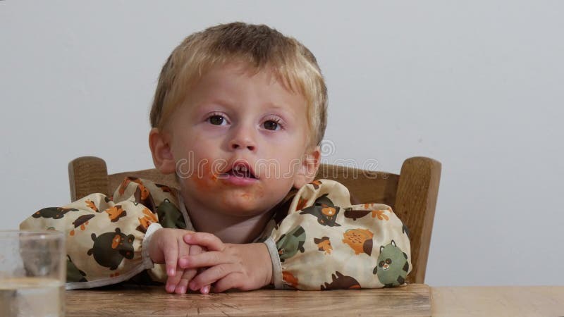 Young Boy is Sitting on a Table in a Restaurant Stock Photo - Image of ...