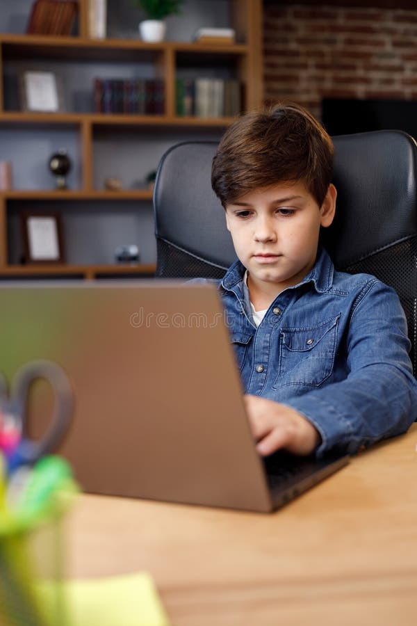 Portrait of Young Boy Studying Remotely at Home Using Laptop. Cute ...