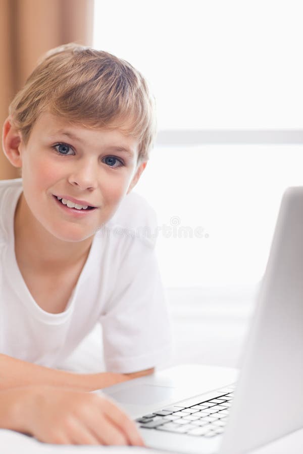 Portrait of a Young Boy Using a Laptop Stock Image - Image of childhood ...