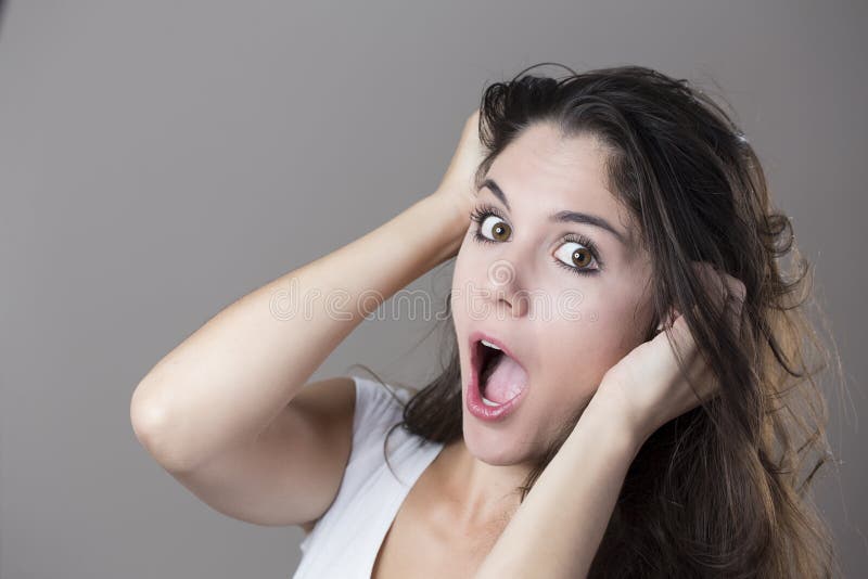 Portrait of a Young Brunette Woman Making Faces with Different E Stock ...