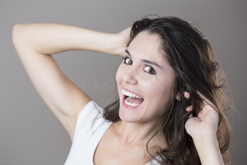 Portrait of a Young Brunette Woman Making Faces with Different E Stock ...