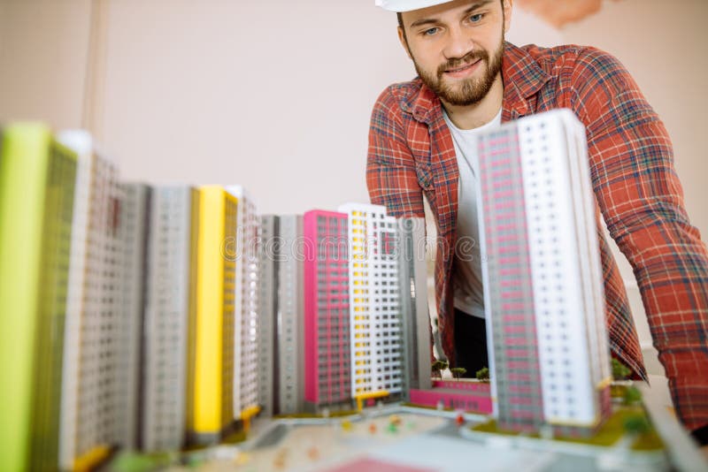 Young Builder Assemble Complex Building Model, Construction Stock Photo ...