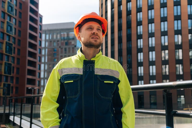 Portrait of a Young Builder in Special Clothes, Male Engineer Thinking ...