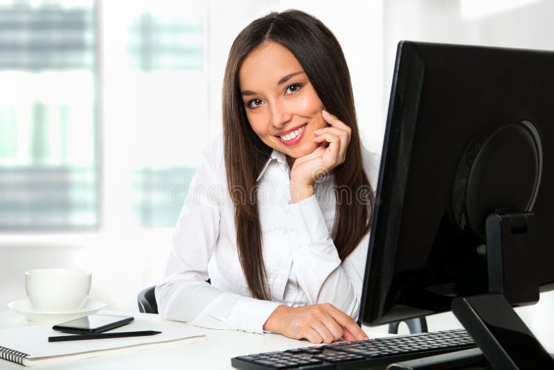 Portrait of a Young Business Woman Using Computer at Office Stock Photo ...