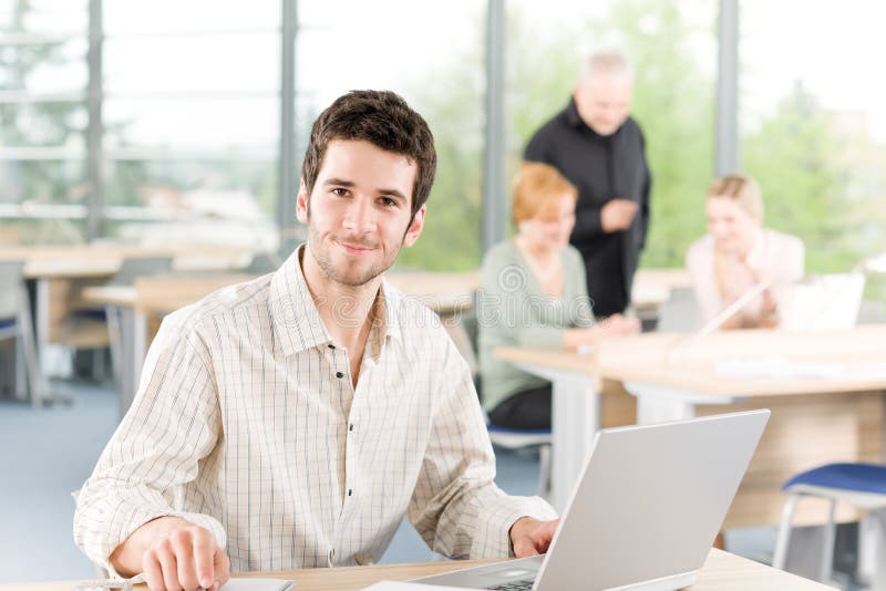 Portrait of Young Businessman with Team in Back Stock Image - Image of ...