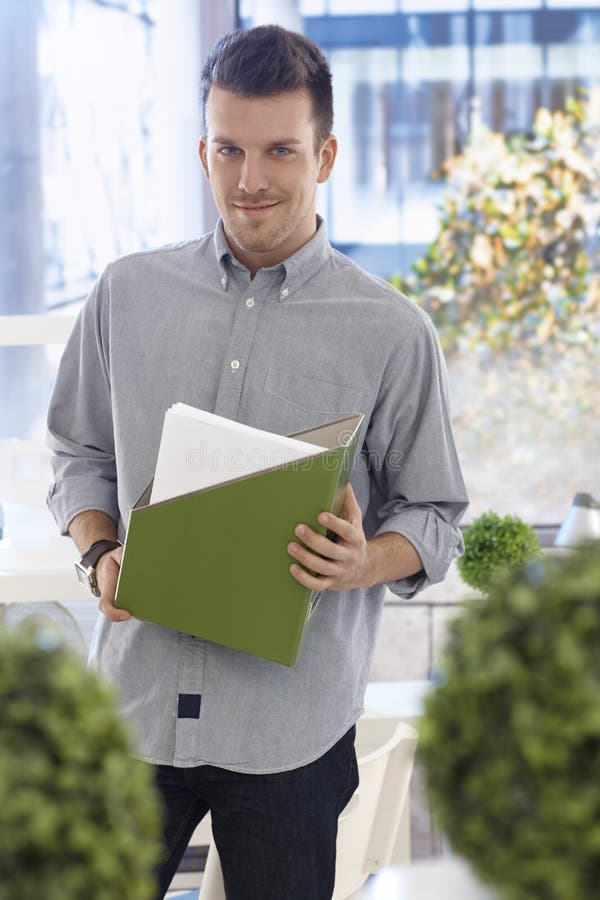 Portrait of Young Casual Office Worker Smiling Stock Image - Image of ...