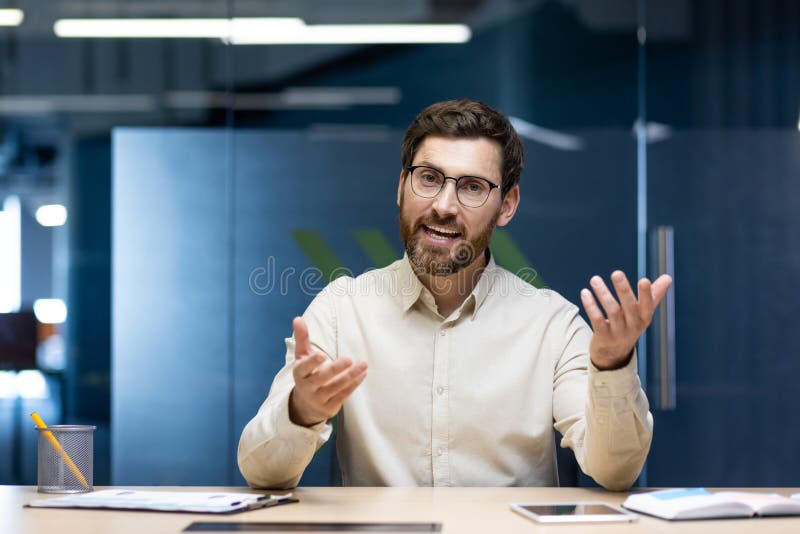 Portrait of a Young Caucasian Man Conducting a Video Conference Sitting ...