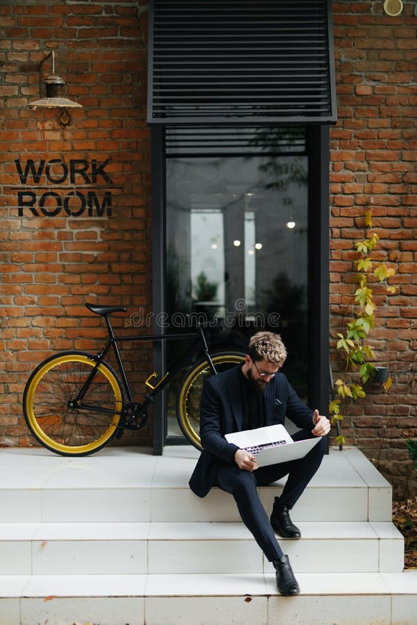 Portrait of Young Cheerful Handsome Bearded Man Looking Aside Using ...