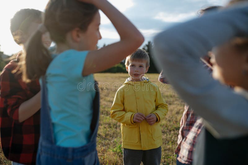Portrait of Young Classmate Playing Hand Clapping Game Outdoors ...