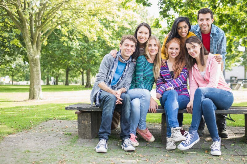 Portrait of Young College Students in Park Stock Image - Image of ...