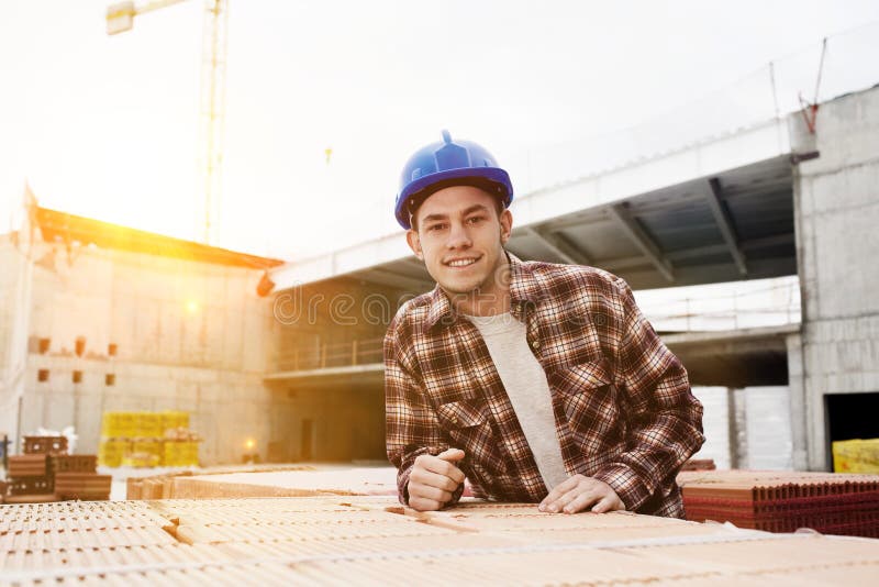 Portrait of a Young Construction Worker at Building Site Stock Photo ...