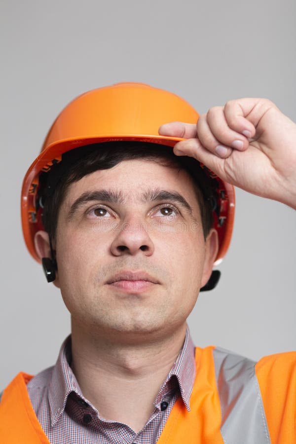 Portrait of Young Construction Worker in Hard Hat on Grey Studio ...