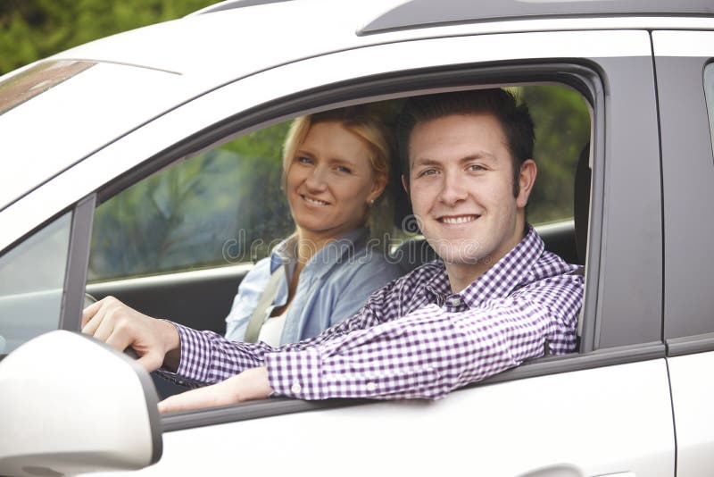 Portrait of Young Couple Looking Out of Car Window Stock Photo - Image ...