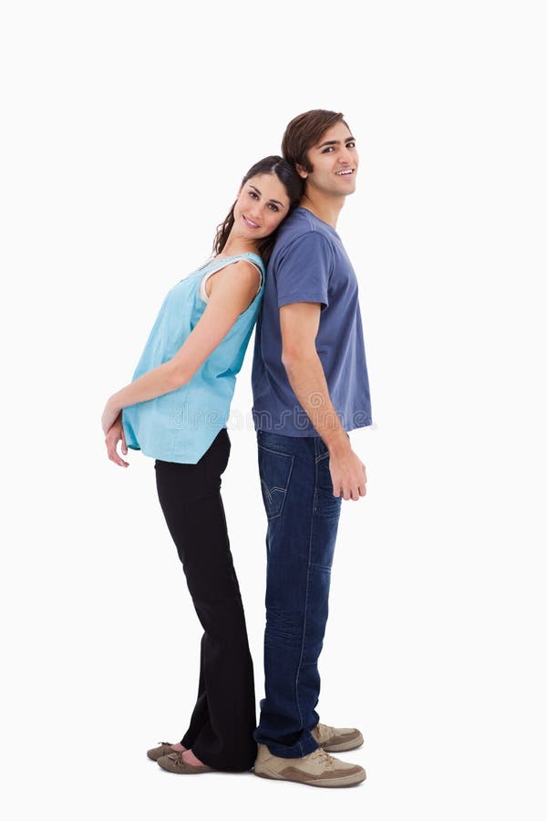 Casual Couple Standing Back To Back Stock Image - Image of feelings ...