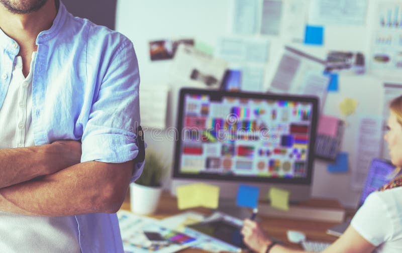 Portrait of Young Designer in Front of Laptop and Computer while ...