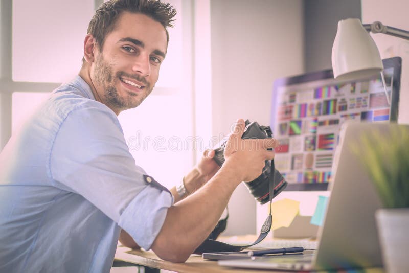 Portrait of Young Designer Sitting at Graphic Studio in Front of Laptop ...
