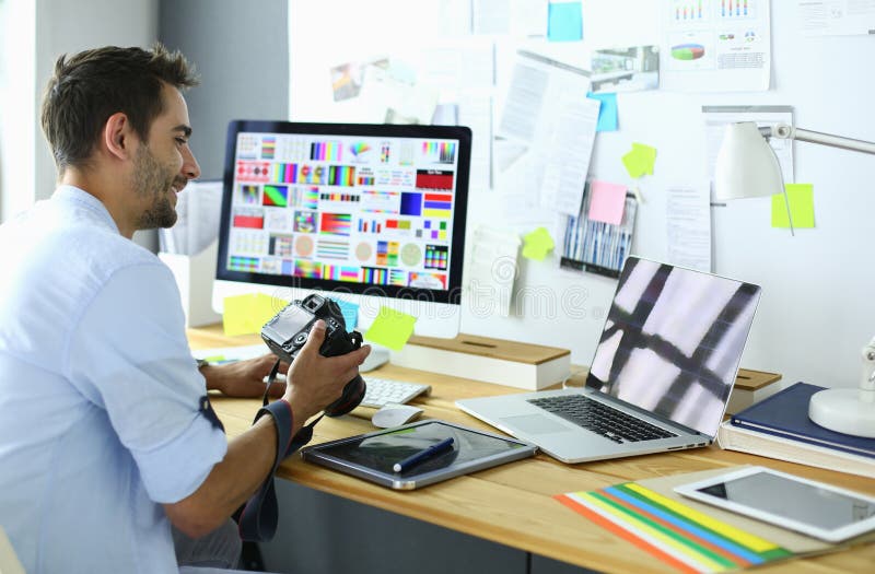 Portrait of Young Designer Sitting at Graphic Studio in Front of Laptop ...